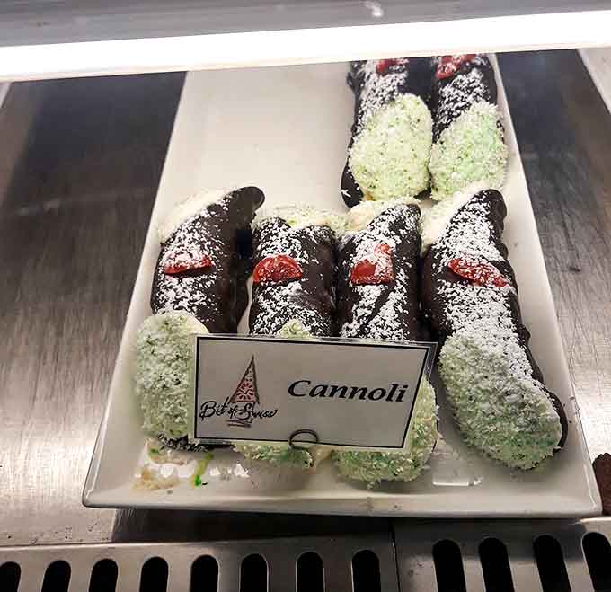 Cannoli: Crisp chocolate shells filled with sweet ricotta cream and tipped with vibrant pistachios &ndash; Sicily's gift to Michigan sweet tooths.