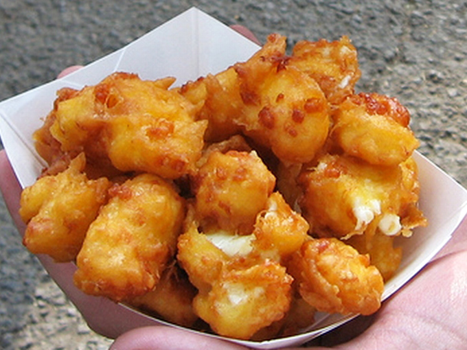 Golden nuggets of joy &ndash; cheese curds fresh from the fryer with that perfect pull when you bite into them, revealing molten centers.