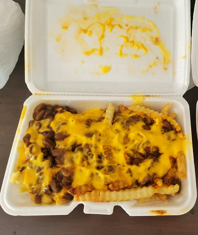 Chili cheese fries piled high with rich, savory toppings&mdash;each bite bursting with bold flavor and satisfaction.