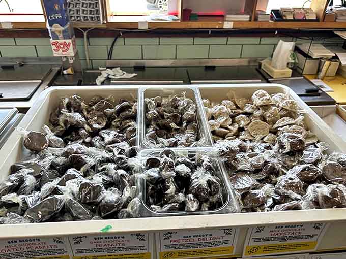 Homemade chocolates waiting patiently in their display case, like sweet little soldiers ready for deployment to deserving taste buds.
