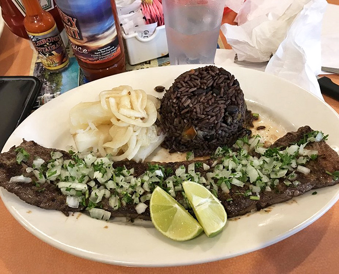 Perfectly grilled beef topped with fresh herbs and lime &ndash; simplicity elevated to an art form with black beans alongside.