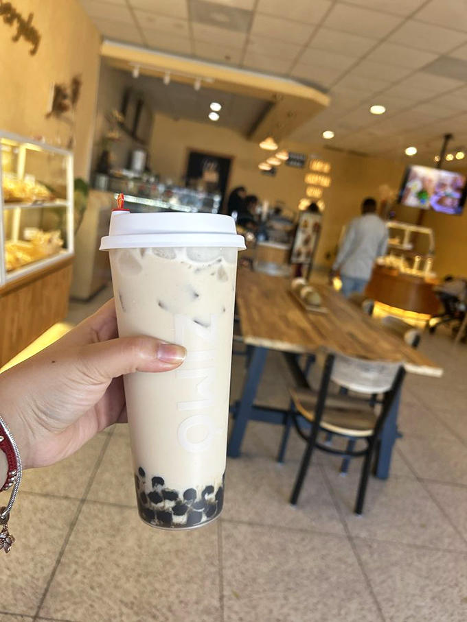 Boba pearls swimming in creamy coconut milk tea &ndash; like an edible pearl necklace for your taste buds. Chewy, sweet perfection!