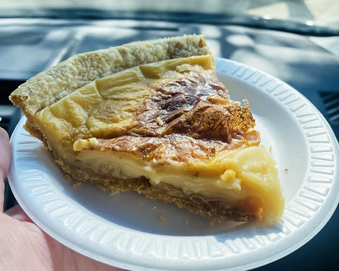 A silky cream pie with a rich, velvety filling sits inside a perfectly tender, house-made crust.