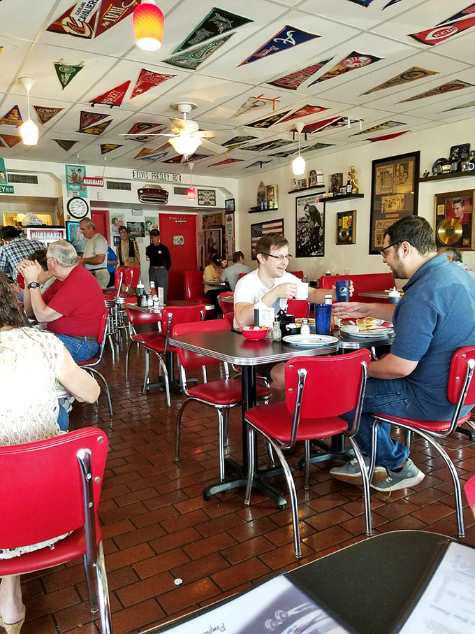 Diners: Where strangers become temporary neighbors, united by the universal language of "pass the syrup, please."