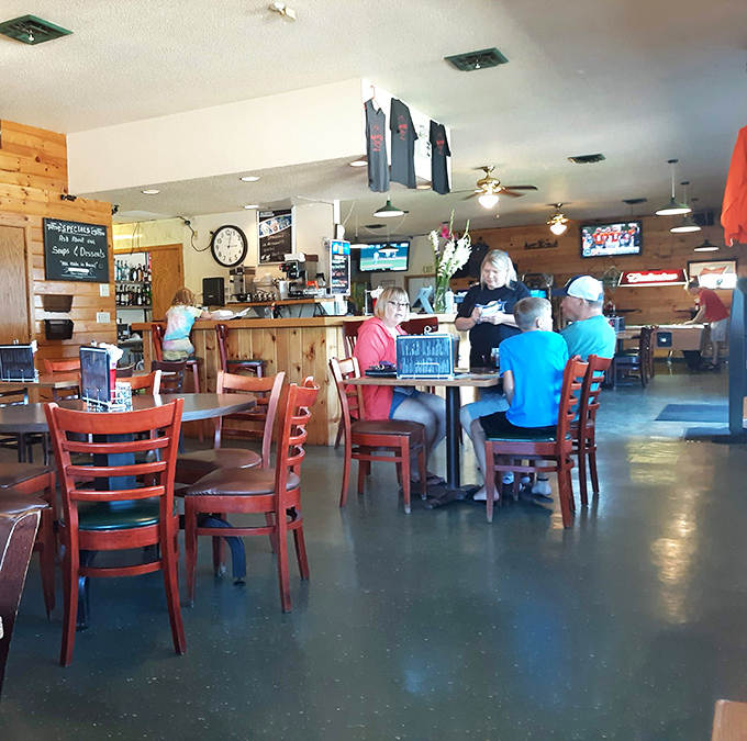 The dining room buzzes with conversation and laughter as locals and visitors alike gather to share stories and exceptional food.