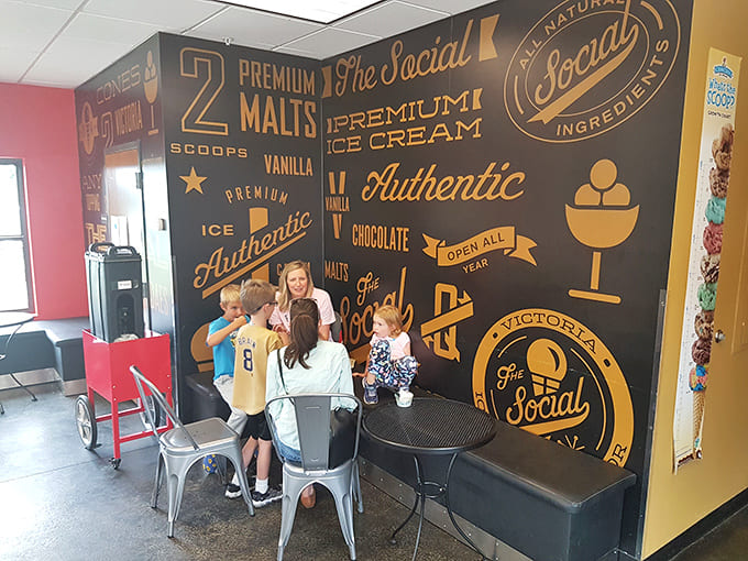A table of diners experiencing the communal joy of barbecue, where conversation pauses only for appreciative nods between bites.