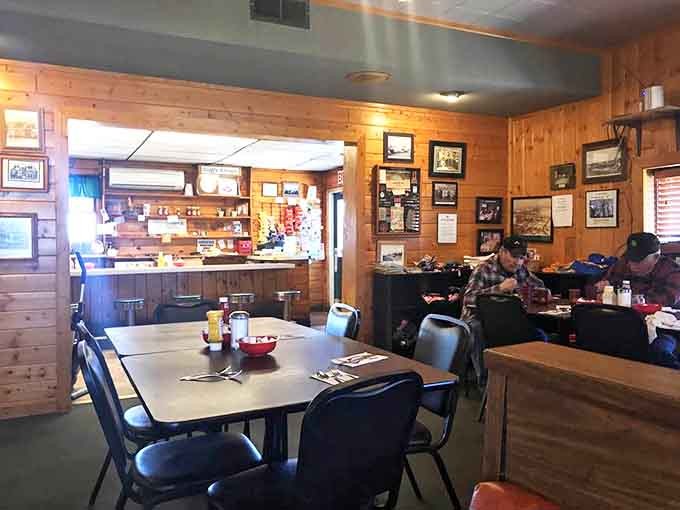 The dining area's warm wood paneling, vintage photographs, and comfortable seating invite you to linger over coffee and conversation.