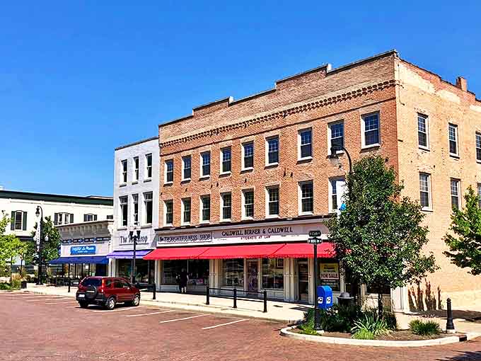 Historic downtown buildings showcase the architectural pride of another era, their storefronts inviting modern shoppers into spaces with stories to tell.