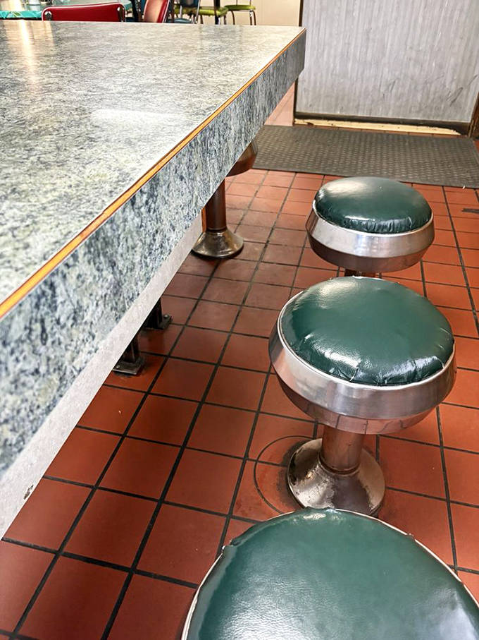 Classic diner counter seating with vintage green vinyl stools invites solo diners to perch and become part of the Eagle Valley's daily community theater.
