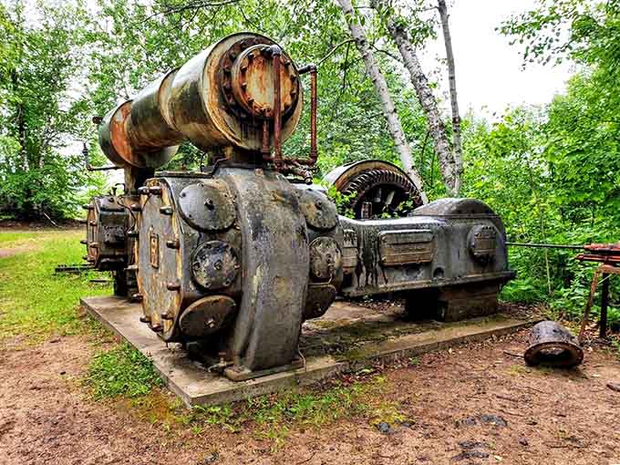 This mechanical behemoth once powered the mine's operations, its massive gears and pistons frozen in time like industrial sculpture.