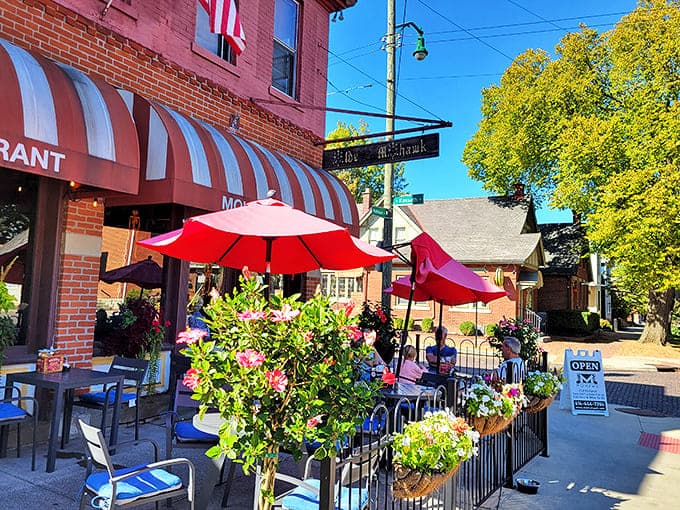 The outdoor patio blooms with flowers and conversation, creating a German Village oasis where time slows down just enough to savor every bite.