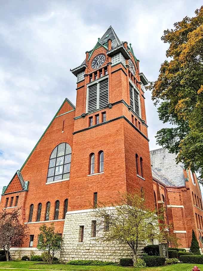 First Congregational Church's distinctive red brick tower keeps watch over Manistee, its clock marking time for generations of residents.