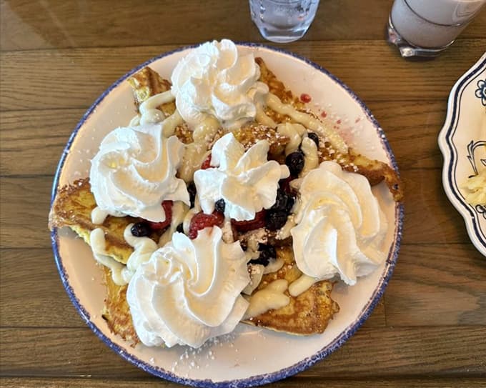 French toast emerges golden and glorious, thick slices transformed into custardy perfection that makes you understand why people write poetry about breakfast.