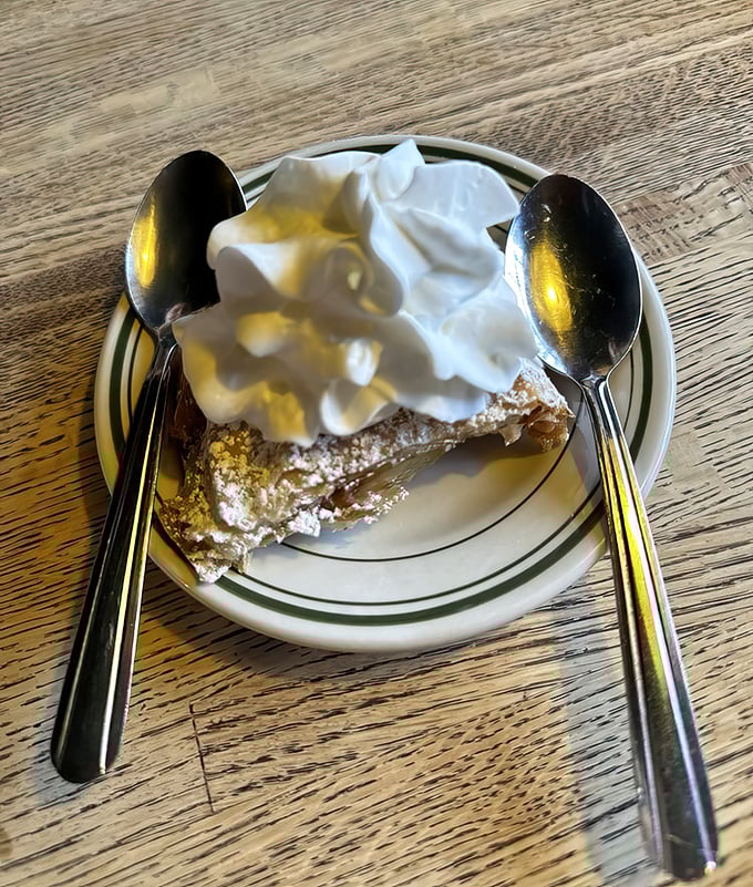 Sweet finale: Apple strudel crowned with whipped cream provides the perfect ending to a meal steeped in Hungarian-American tradition.