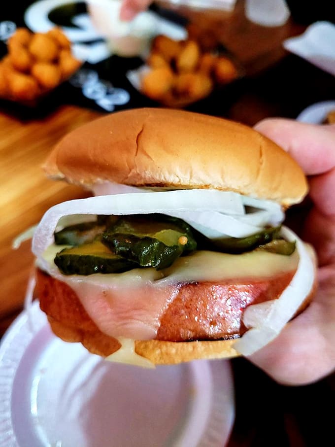The fried bologna sandwich &ndash; America's unsung lunch hero, elevated to art form with pickles and onions that cut through the richness perfectly.