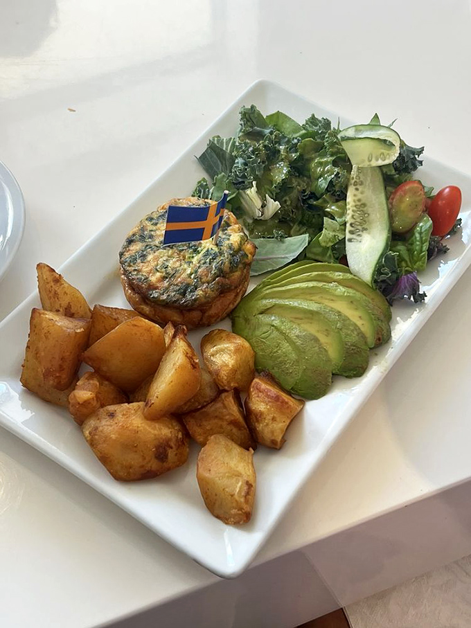 Frittata: A Swedish flag marks this territory of perfectly cooked eggs, surrounded by golden potatoes and fresh greens &ndash; breakfast diplomacy at its finest.