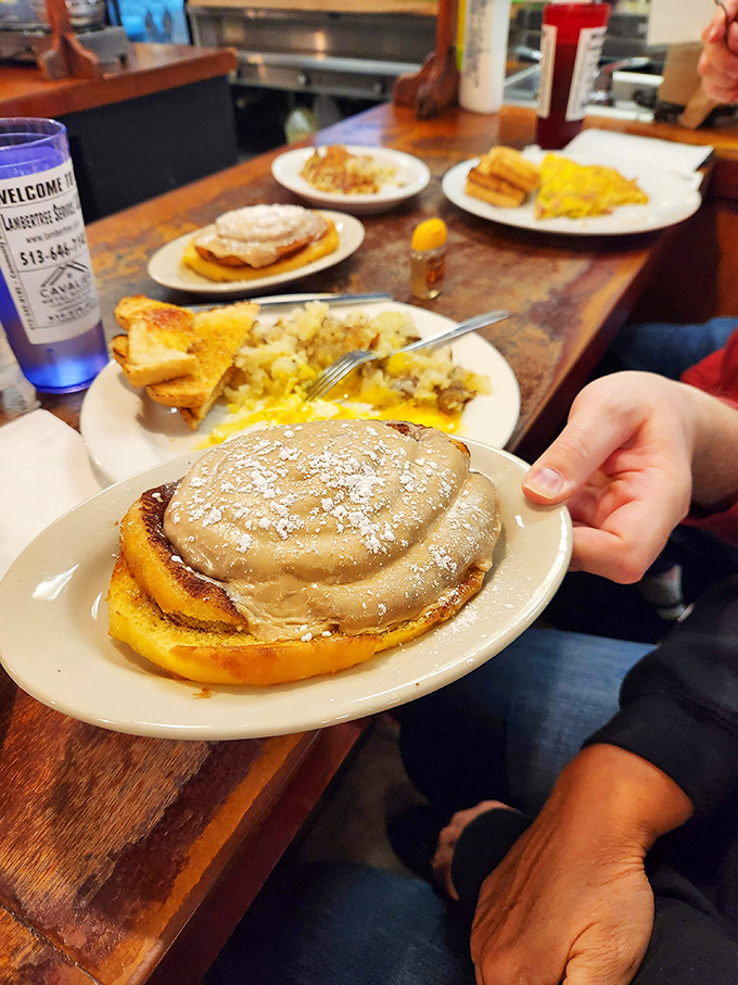 Pancakes so fluffy they could float away, smothered in what appears to be cinnamon butter &ndash; breakfast that flirts with dessert territory.