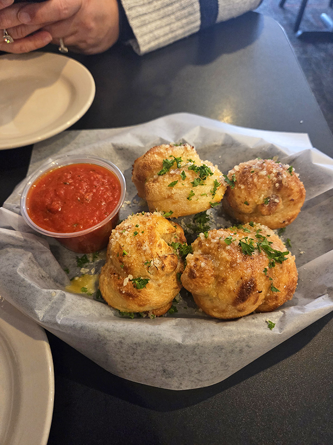 These aren't just garlic knots &ndash; they're pillowy clouds of garlicky goodness that have caused many a "just one more" negotiation at Padrino's tables.