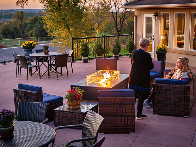 Guests enjoy twilight conversations around a sleek fire table, proving that the best vacation memories often happen after sunset.