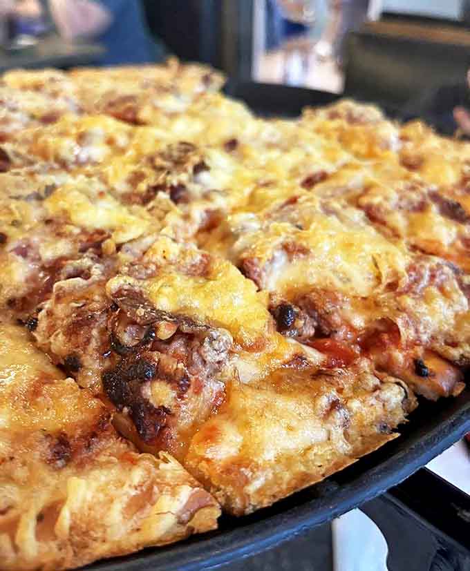 Comfort food at its finest &ndash; this hearty pizza loaded with gouda, mozzarella, sausage and bacon satisfies the most serious appetites.
