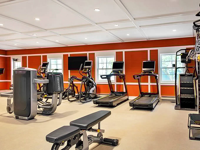Even working out feels grand in this vibrant orange fitness center, proving the hotel's commitment to modern amenities while maintaining its distinctive personality.
