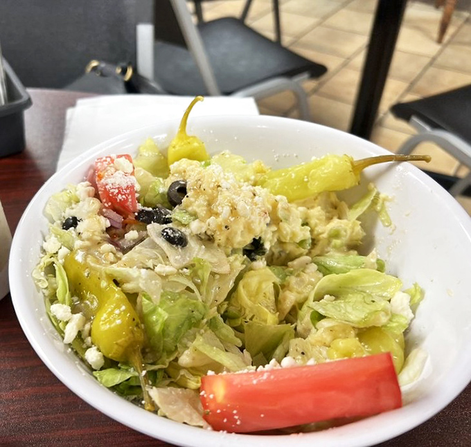 A Greek salad that brings Mediterranean freshness to the table &ndash; the diner's nod to Florida's diverse culinary influences.