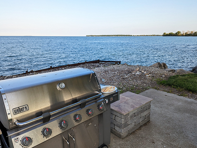 Lakeside grill with water view: The ultimate dining room – where fresh-caught walleye meets sunset views and conversation replaces television.