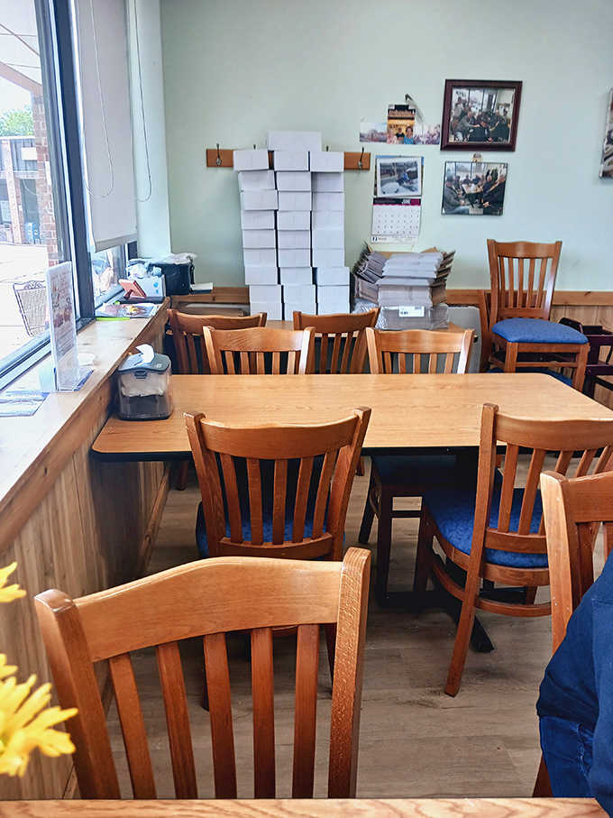 Simple wooden tables and chairs create a cozy spot to slow down and actually savor your treats instead of inhaling them in the car like some donut-crazed fugitive.