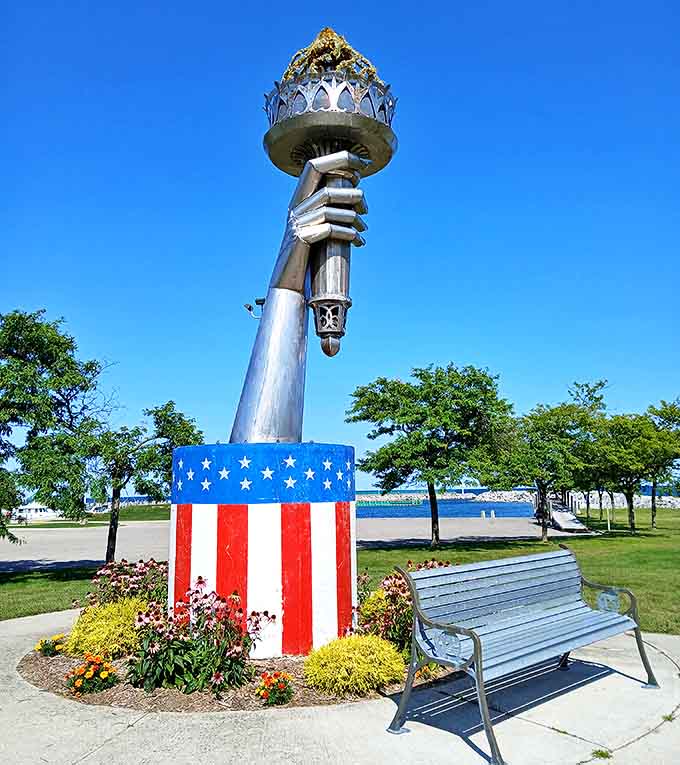 This striking hand sculpture holding the Statue of Liberty's torch combines patriotism and artistry in a uniquely American roadside attraction.