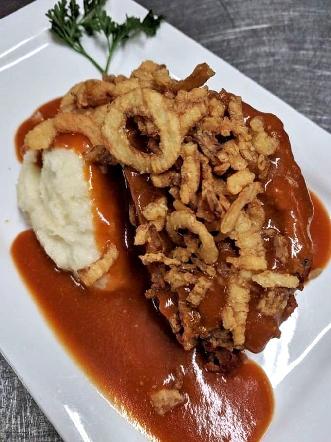 Homemade meatloaf that will erase childhood trauma &ndash; moist, flavorful, and topped with crispy onion strings for textural magic.