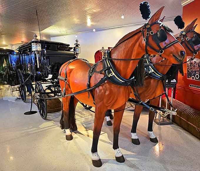 The museum's horse-drawn hearse display includes meticulously detailed model horses, complete with traditional funeral plumes and ceremonial dressing.