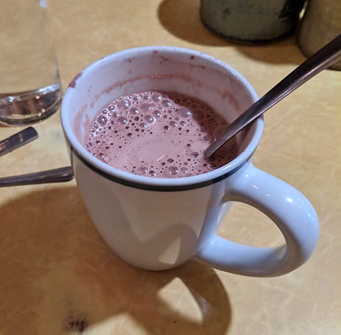 Real hot chocolate served in sturdy mugs &ndash; not powdered nonsense, but cocoa richness that warms you from the inside out.