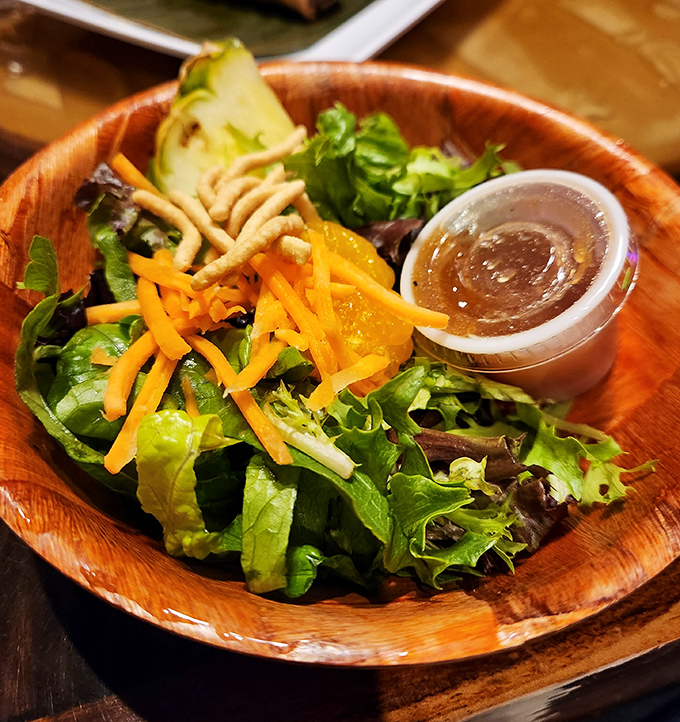 Even the salad gets the aloha treatment &ndash; fresh greens, mandarin oranges, and carrots creating a colorful prelude to island flavors ahead.
