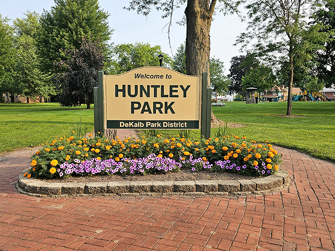Huntley Park welcomes visitors with a burst of floral color, its carefully tended garden beds framing a community gathering place for generations of DeKalb families.