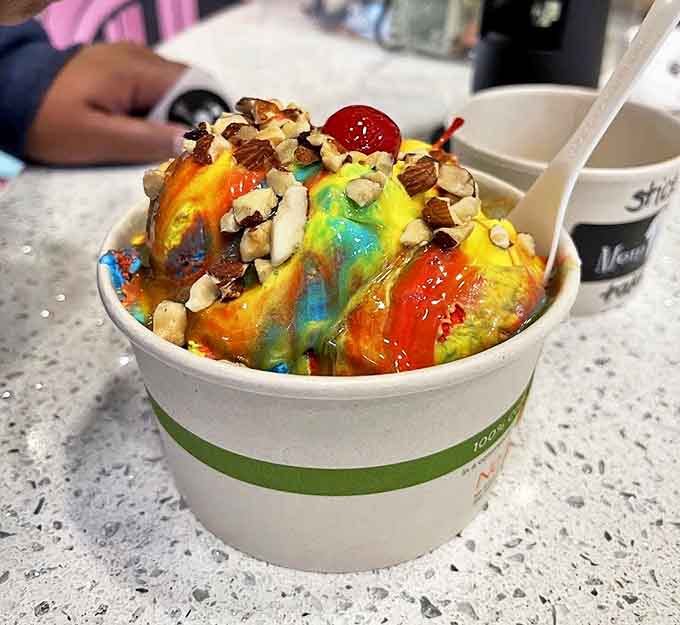 A rainbow explosion in a cup that makes adult responsibilities fade away with each colorful, joy-inducing bite.