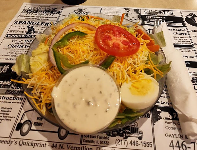 A proper salad with fresh greens and all the fixings, because even pizza lovers need their vegetables sometimes, right?