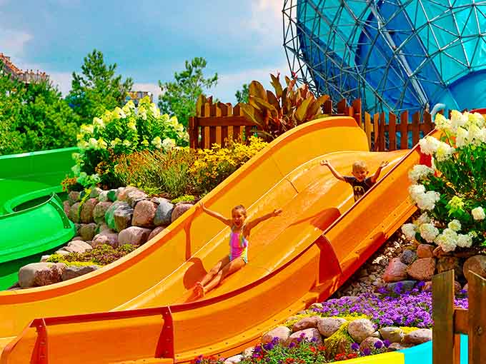 Pure joy captured mid-slide, that magical moment when gravity becomes your playmate and everyday worries wash away with the water.