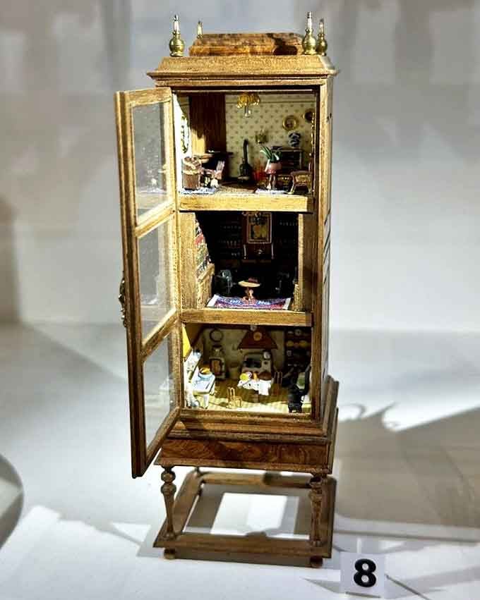 This multi-level miniature cabinet reveals rooms stacked like a layer cake of tiny living spaces. Vertical living, miniature style!