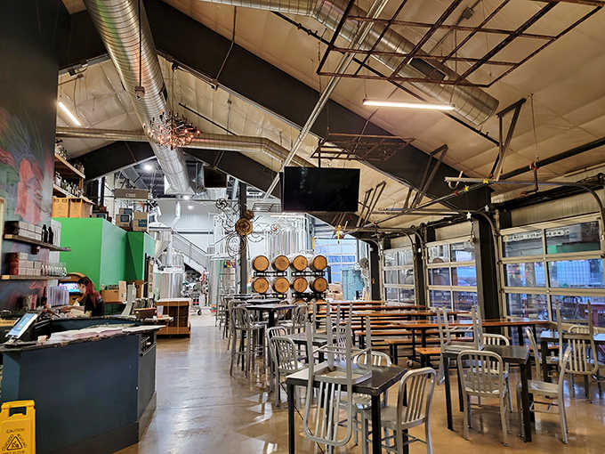 Where brewing equipment becomes theater, with gleaming tanks visible through glass partitions as patrons enjoy the fruits of fermentation.
