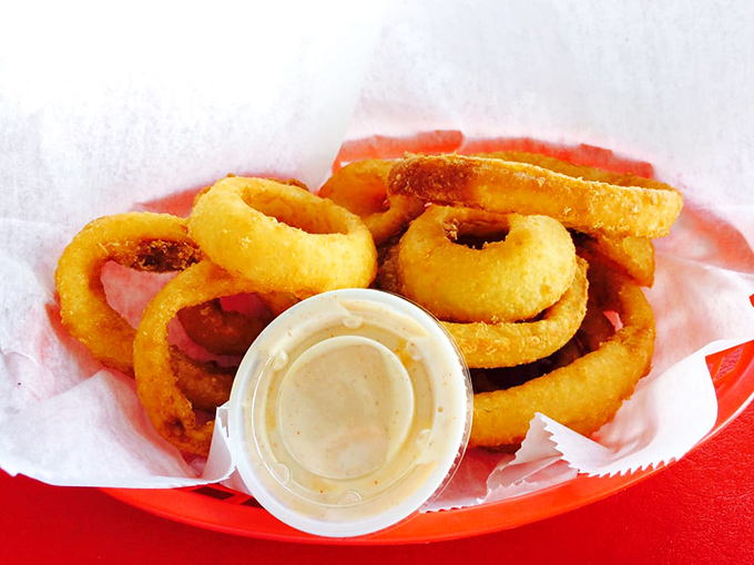 Onion rings with a crunch that could wake the neighbors &ndash; thick-cut sweet onion circles in a batter that shatters satisfyingly with each bite.