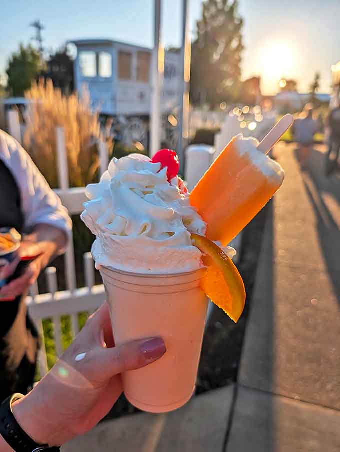The Orange Creamsicle Shake captures sunset in a cup, topped with whipped cream and garnished with orange slice &ndash; summer in liquid form.
