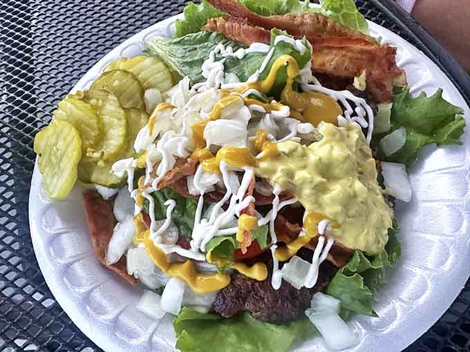 When basic burgers won't do, this loaded creation answers with bacon, multiple condiments, and enough napkins to handle the delicious aftermath.