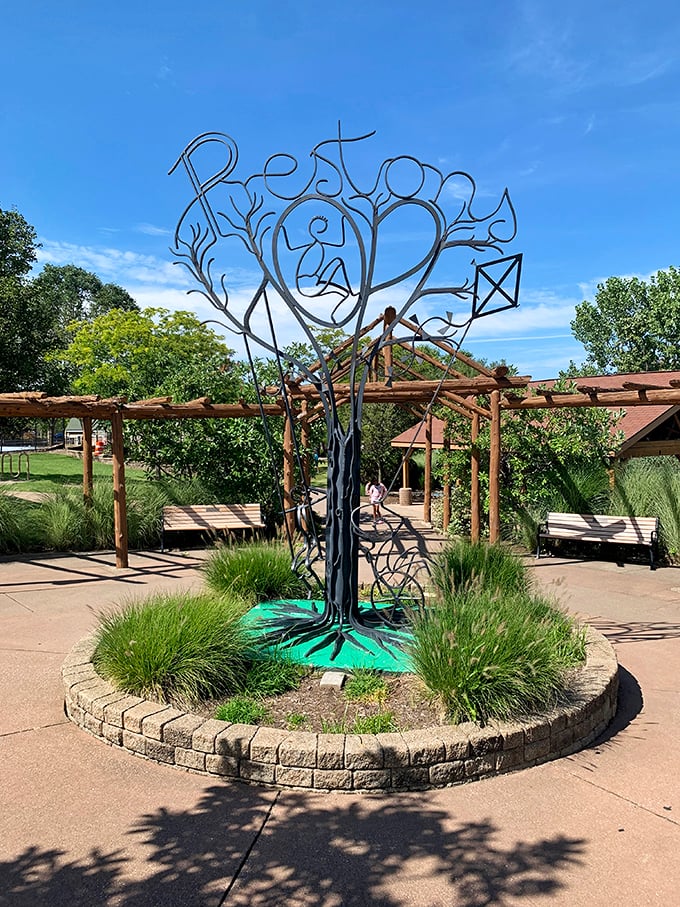 Preston's artistic metal sculpture serves as both beautiful centerpiece and poignant reminder of the playground's inspiring namesake and mission.