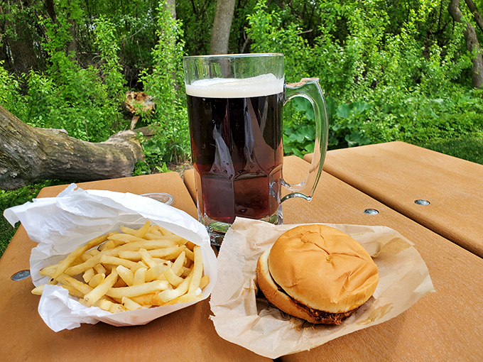 A classic American meal: burger, fries and root beer served in a frosted mug – simple perfection that needs no improvement.