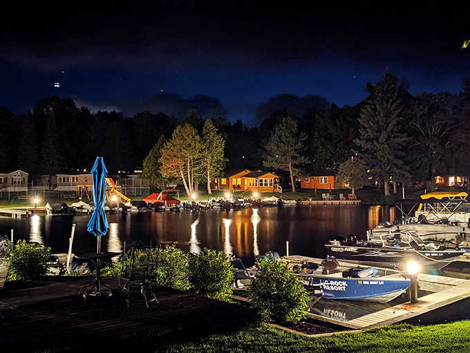 Evening magic at the marina, where cabin lights reflect on still waters and tomorrow's fishing dreams are already being cast.