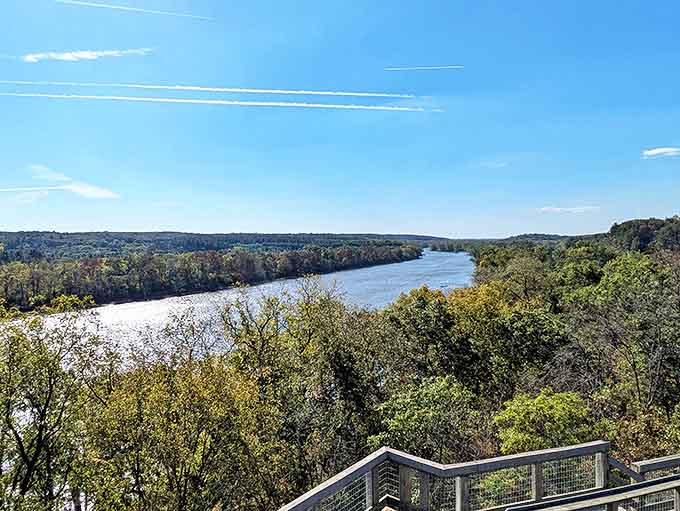 The Rock River curves majestically through the landscape, a silver ribbon tying together forests and fields with liquid grace.