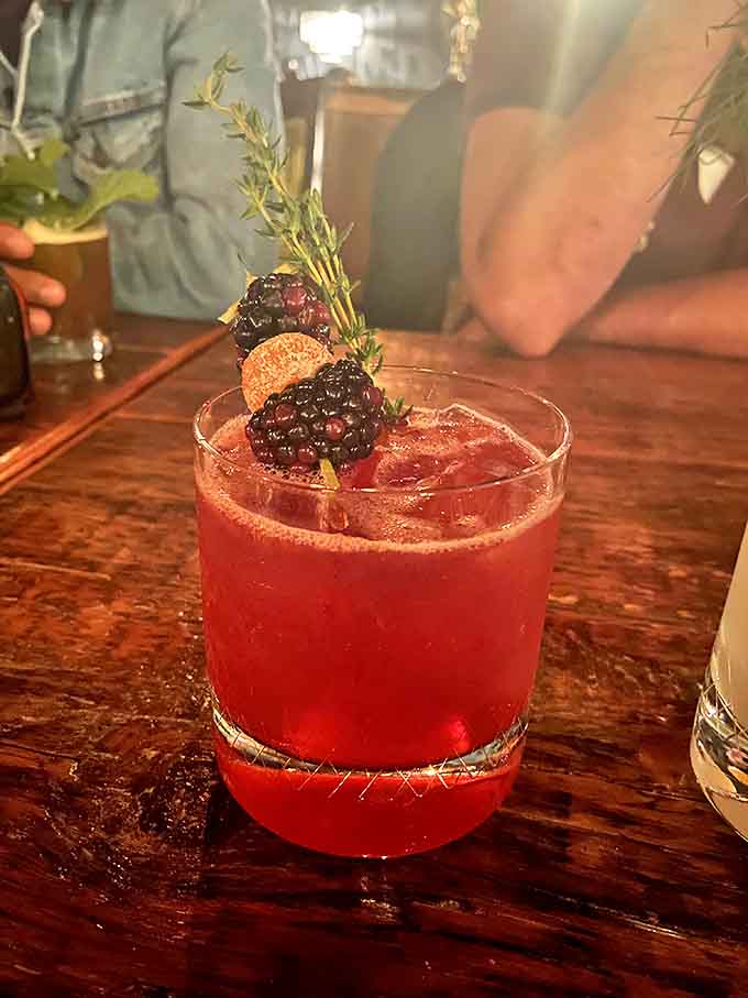 The Sazerac arrives with theatrical wisps of smoke, rye whiskey mingling with Peychaud's bitters in a glass kissed with absinthe.