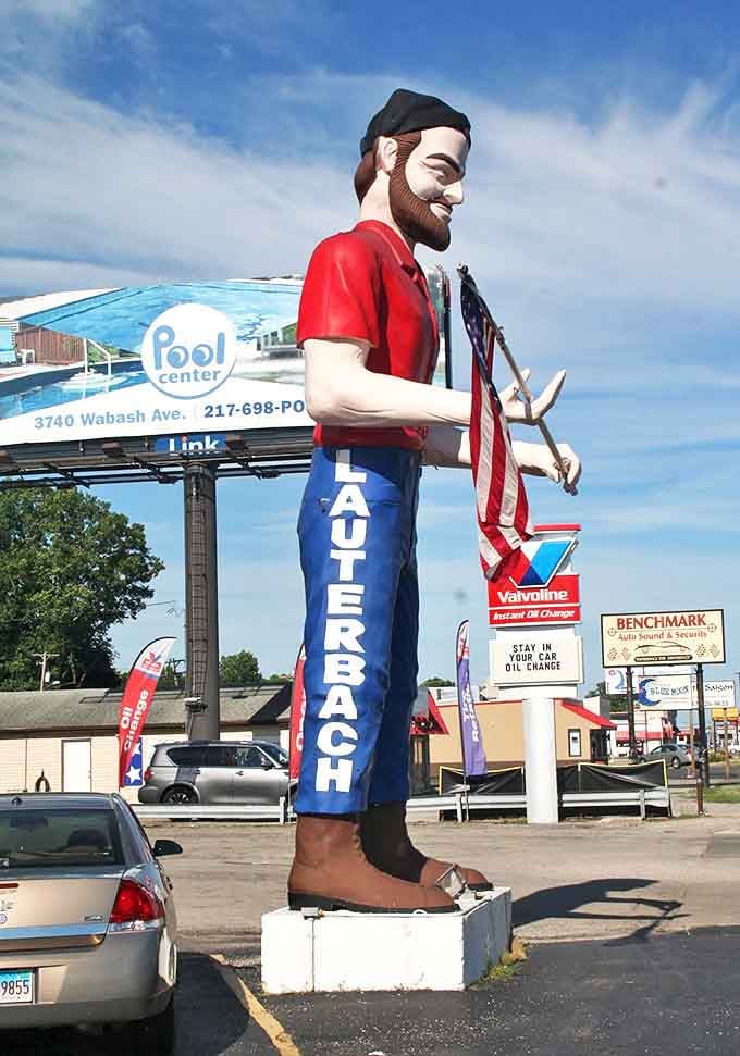 From this angle, you can appreciate the impressive scale of his blue work pants, complete with the "LAUTERBACH" branding down the leg.