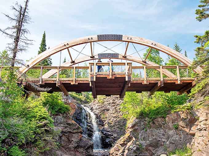 This isn't just a bridge, it's an engineering marvel suspended above Silver Creek Falls, where water meets wilderness.