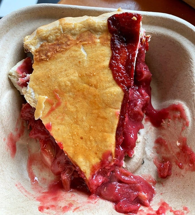 Strawberry rhubarb pie with the perfect sweet-tart balance and a crust so flaky it creates its own weather system of buttery goodness.